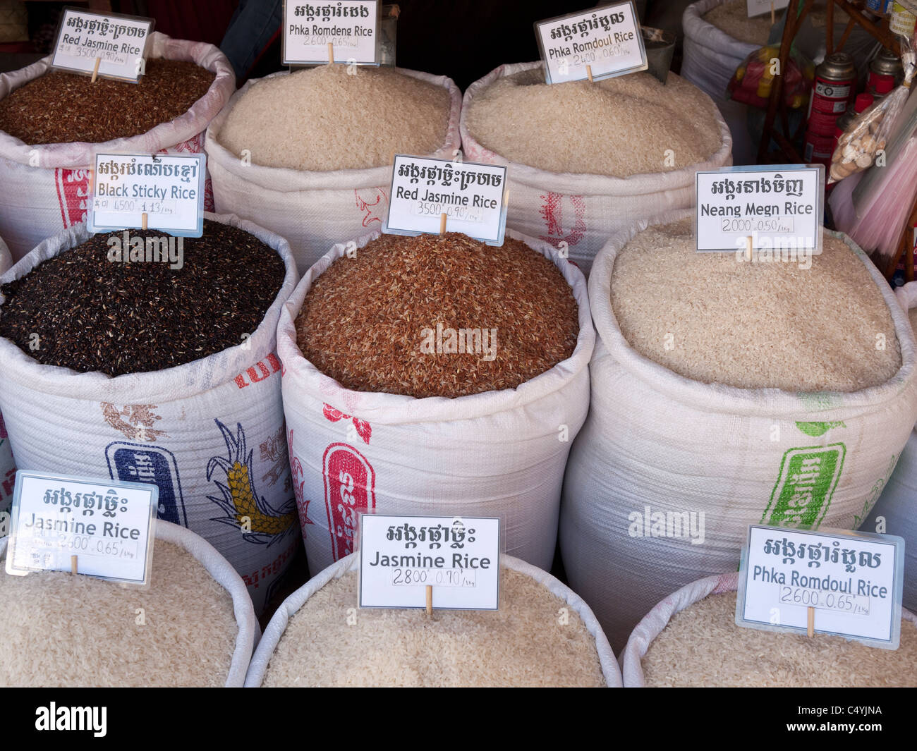 Sacks of red and white jasmine rice, and black sticky rice for sale at ...