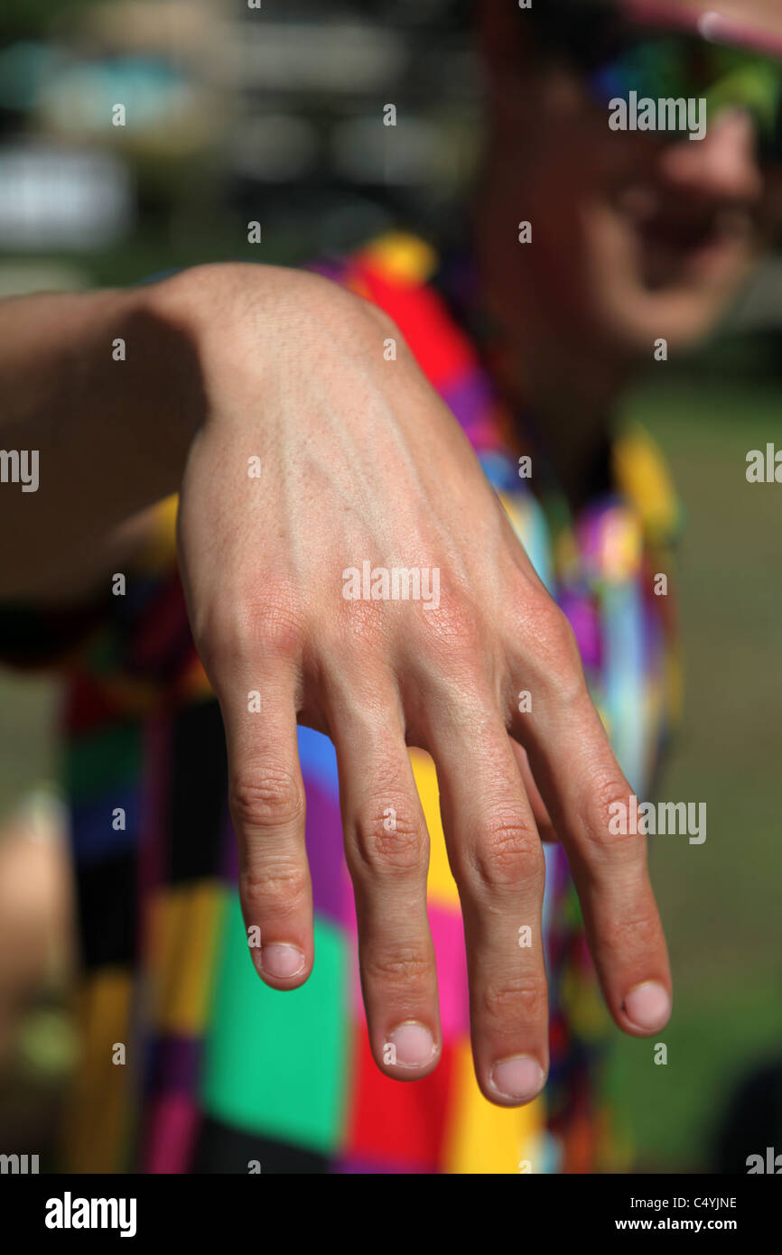 friendly man shows back of hand Stock Photo - Alamy