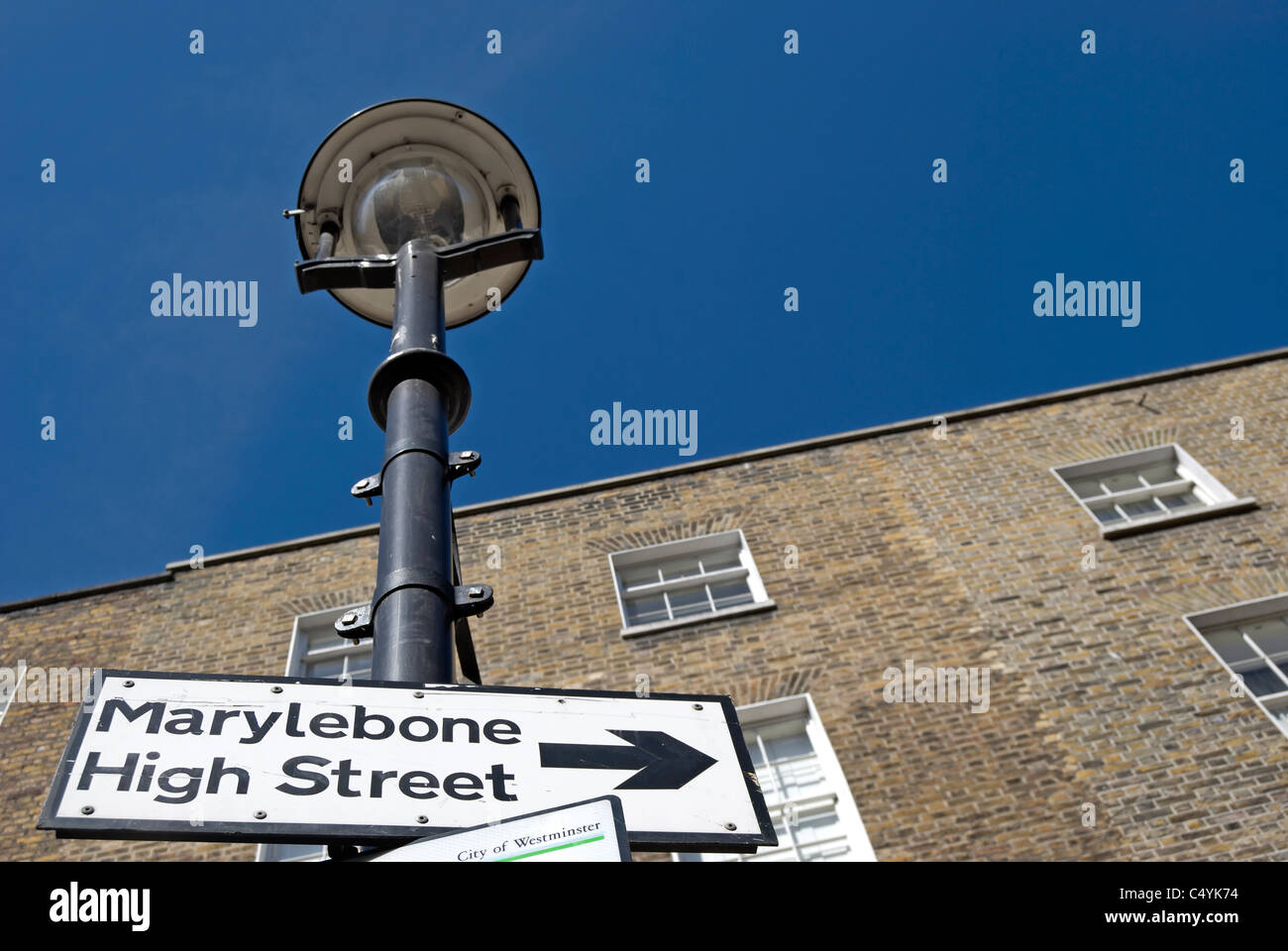 traffic direction sign with arrow for marylebone high street, london ...