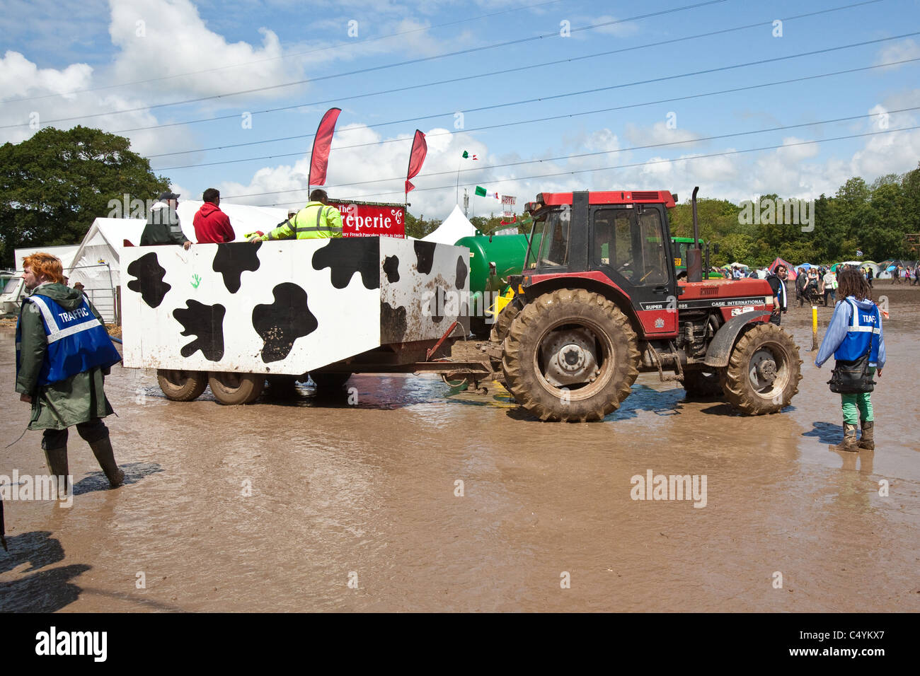 Milk being sold from the back of a tractor at the Glastonbury Festival ...