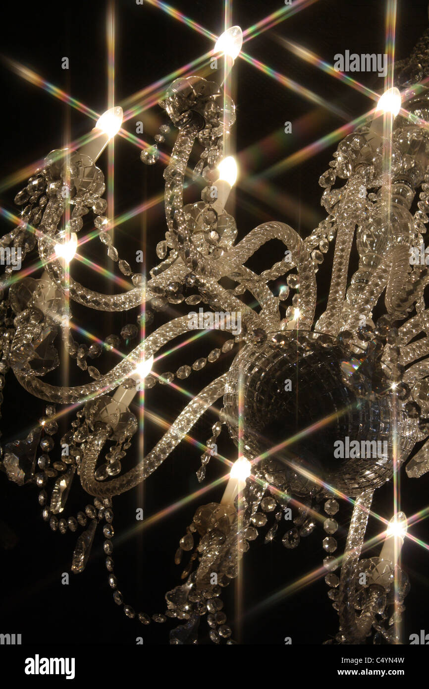 A chandelier emanating light with a star shape Stock Photo - Alamy
