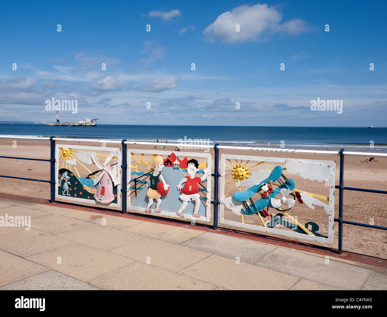 Seaside promenade railings decorated with local scenes at Coatham Beach ...