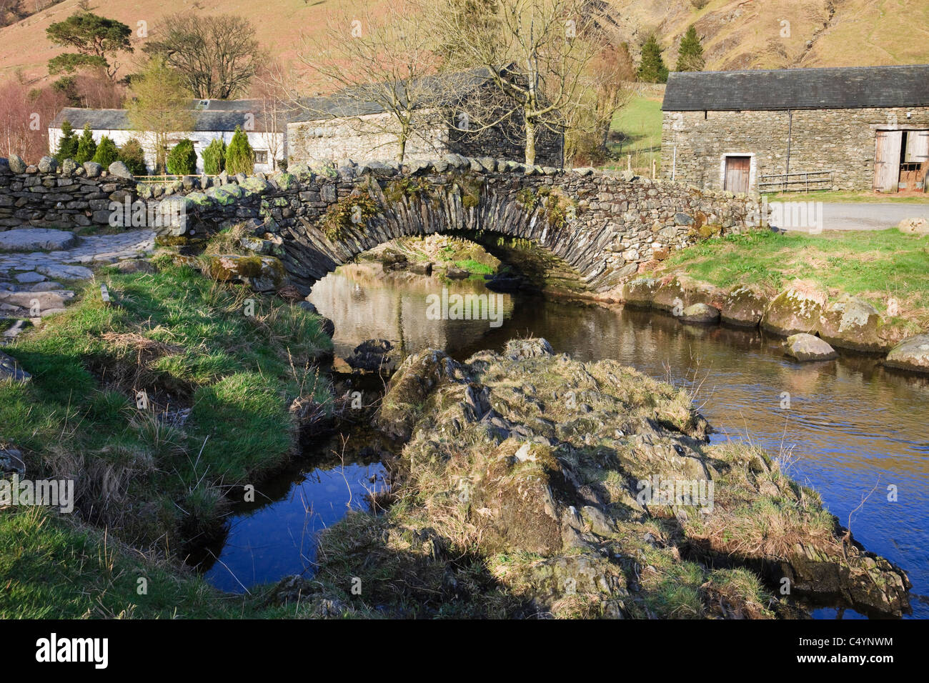 Watendlath, Cumbria, England, UK. Quaint old packhorse bridge over ...