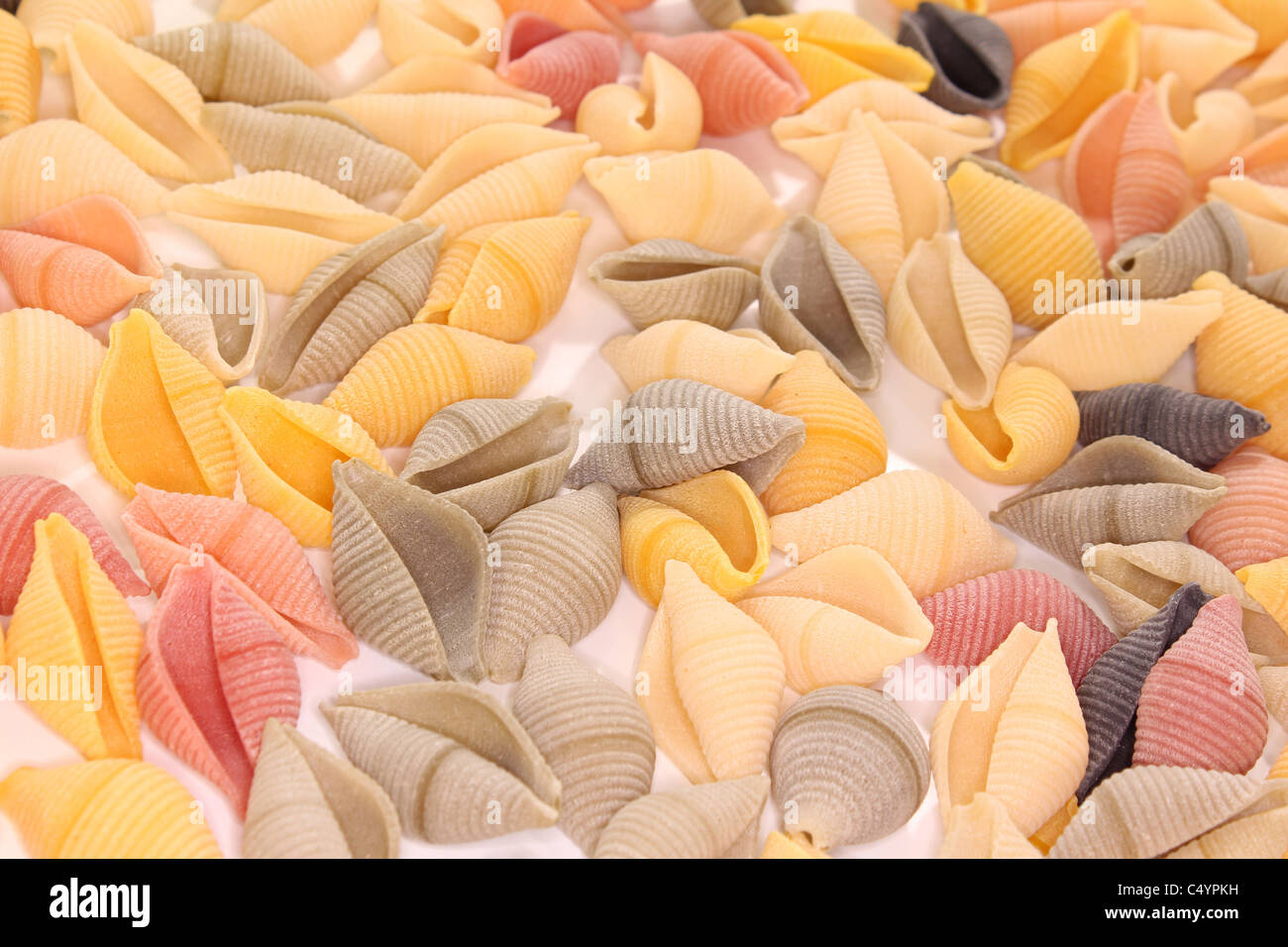 a handful of colored pasta as a background image Stock Photo - Alamy