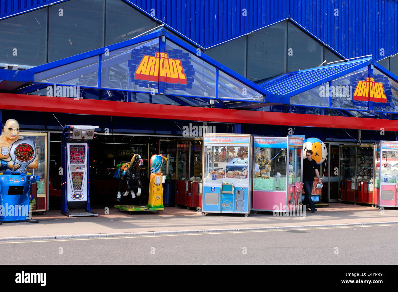 Slot machines and colorful machines in a penny arcade in Minehead ...