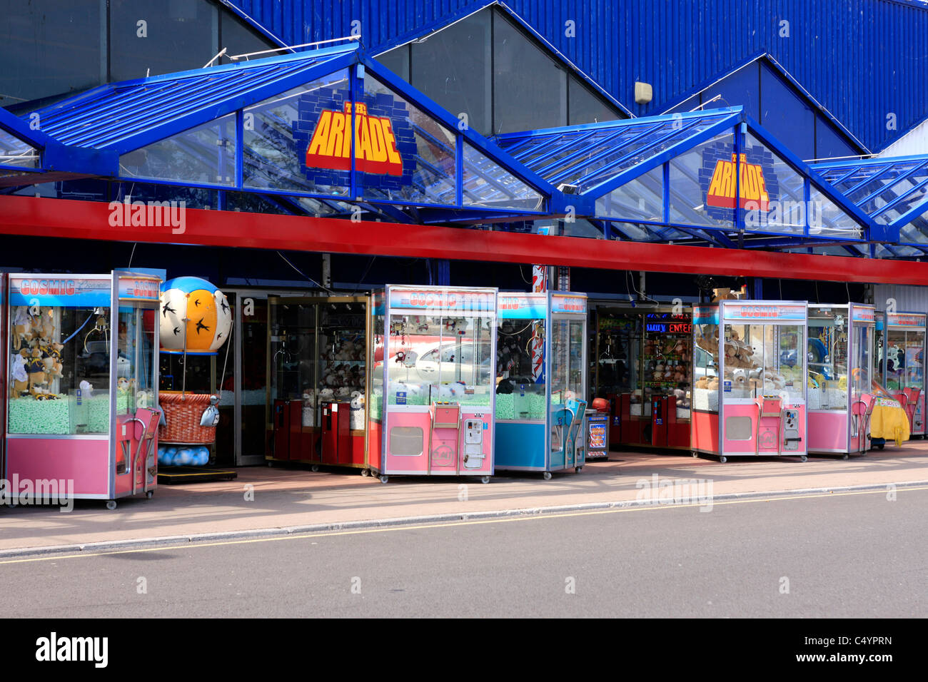 Slot machines and colorful machines in a penny arcade in Minehead ...
