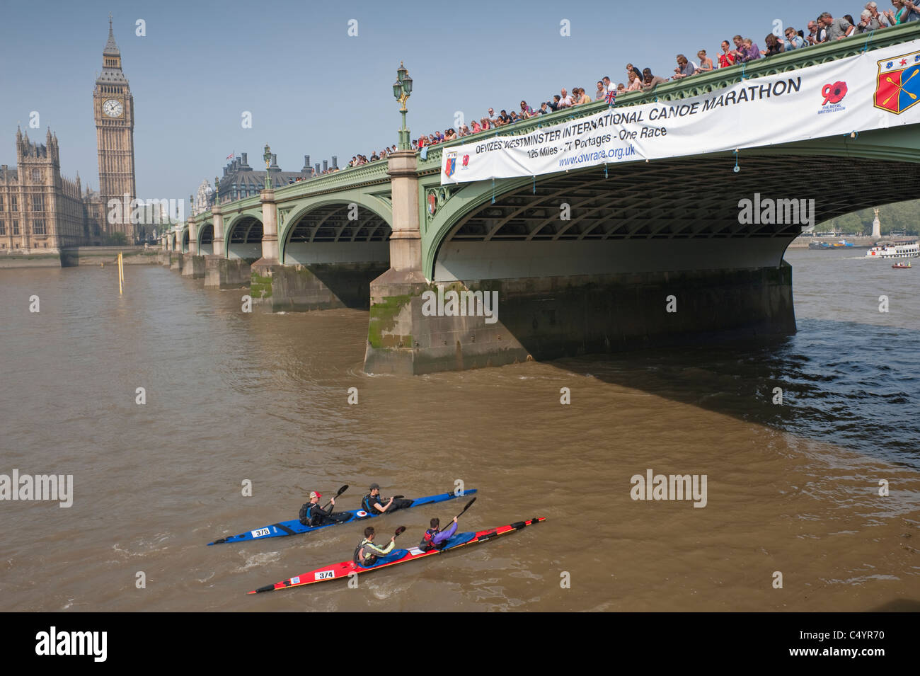 Competitors pass under Westminster Bridge, to finish the grueling 125 ...