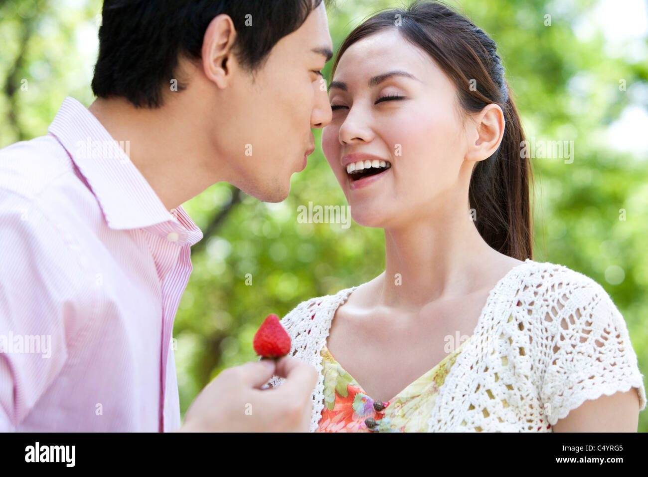 Happy cute couple strawberry fruit hi-res stock photography and images ...