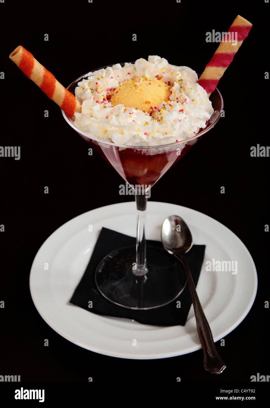 ice cream and fruit dessert with whipped cream and brandy snap biscuits ...