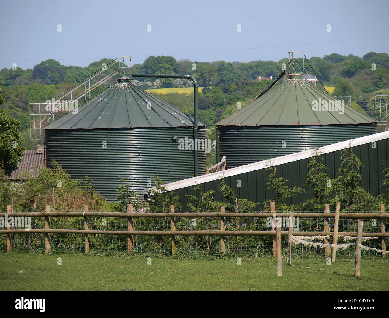 a row of green tanks on farm Stock Photo - Alamy