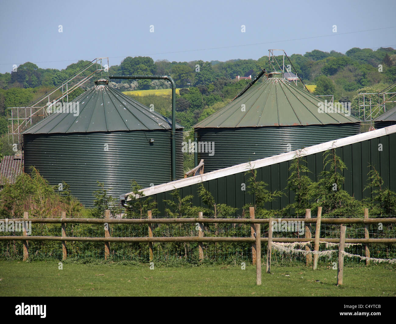 a row of green tanks on farm Stock Photo - Alamy