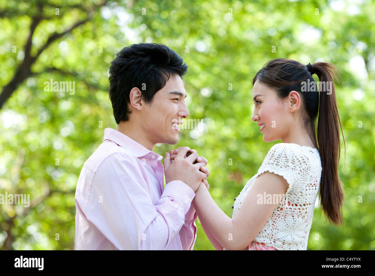 Couple touching each others face hi-res stock photography and images ...