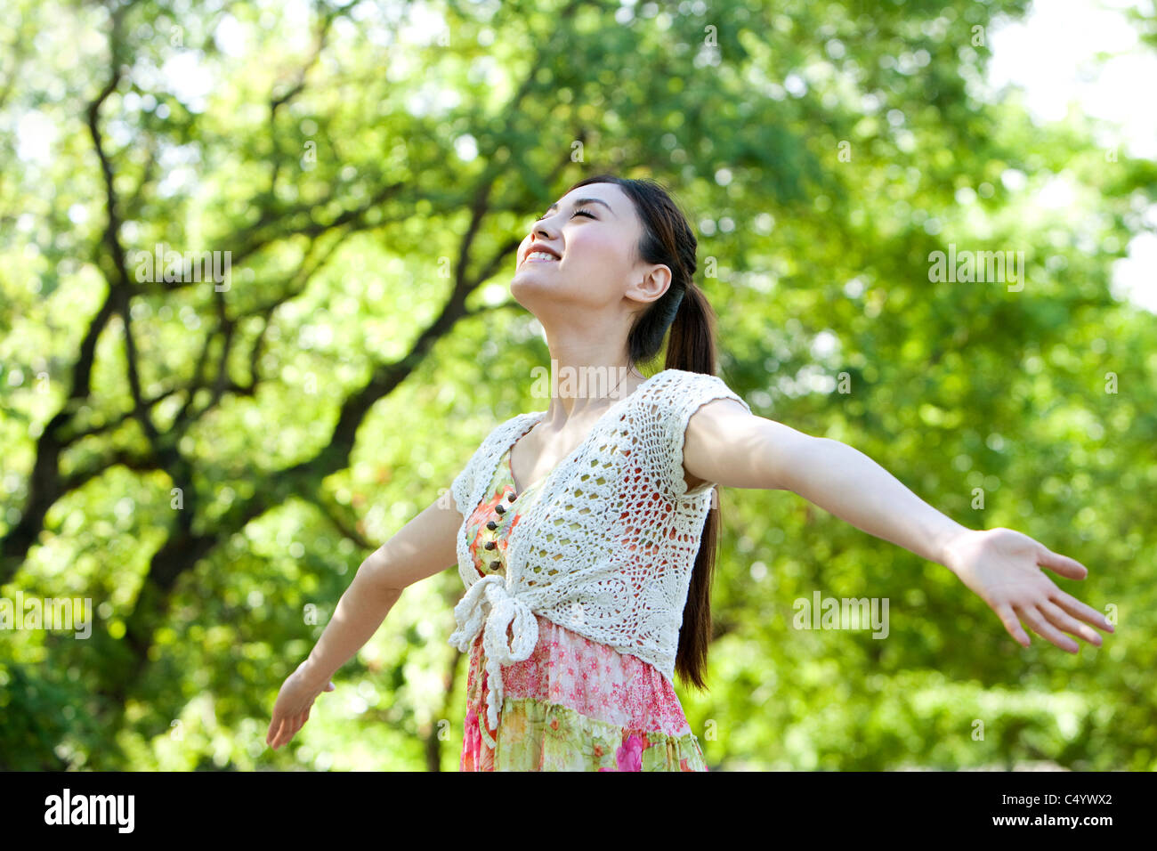 Relaxed Young Woman Stock Photo - Alamy