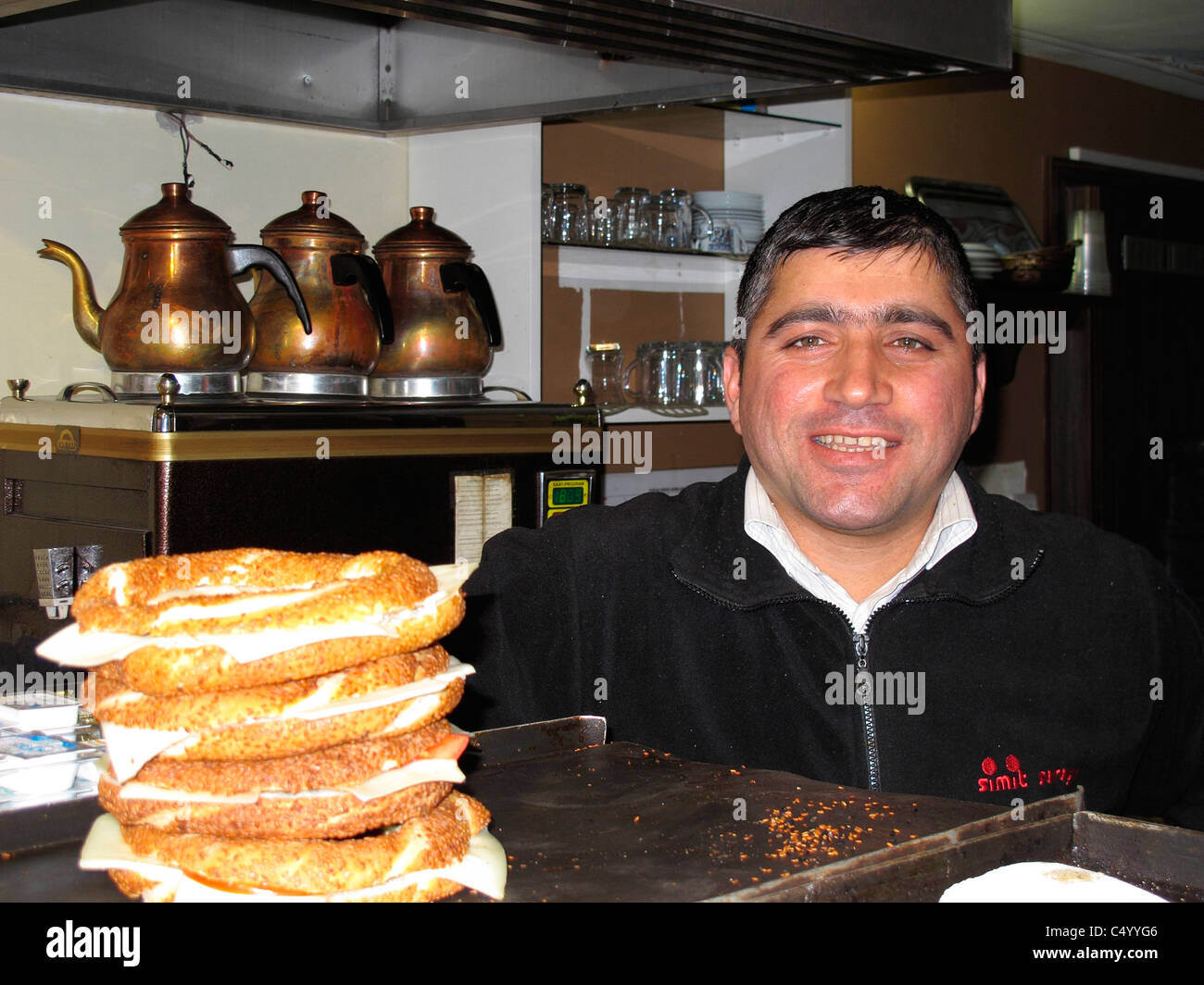 Turkey Istanbul Sultanahmet old town tea house. Shopkeeper smiling in ...