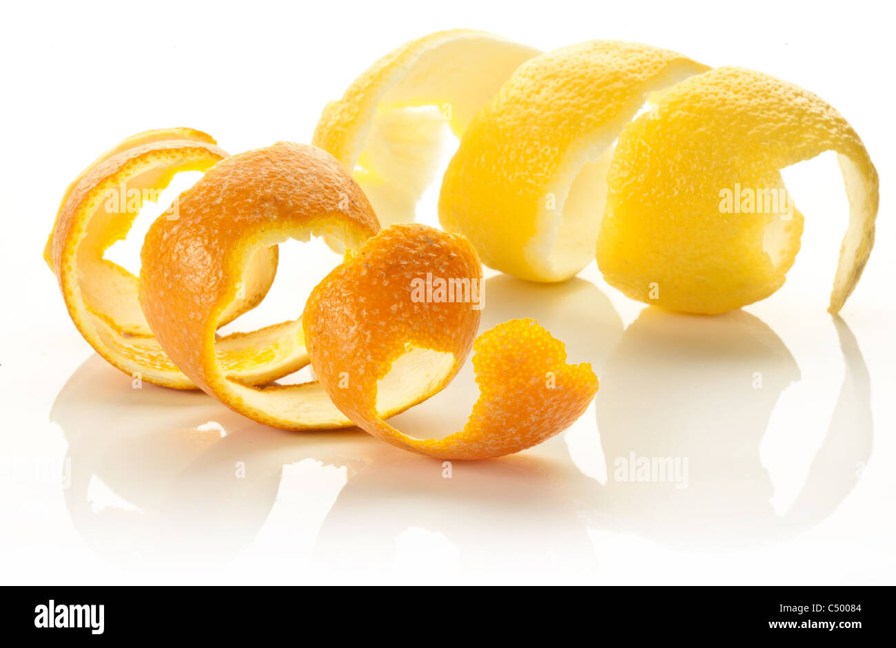 Twist of citrus peel on a white background Stock Photo - Alamy