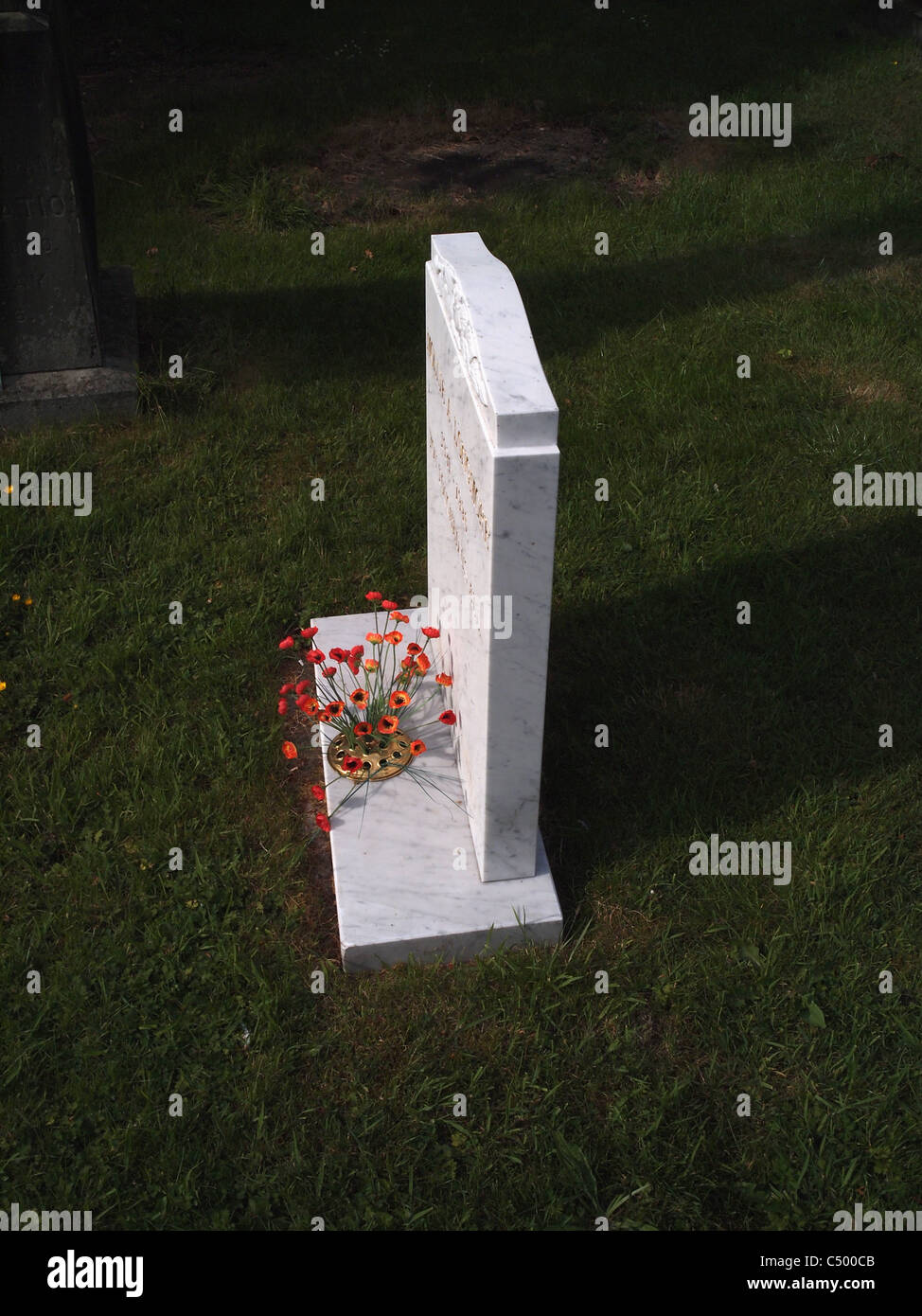 gravestones lit by the sun in a country cemetery Stock Photo - Alamy