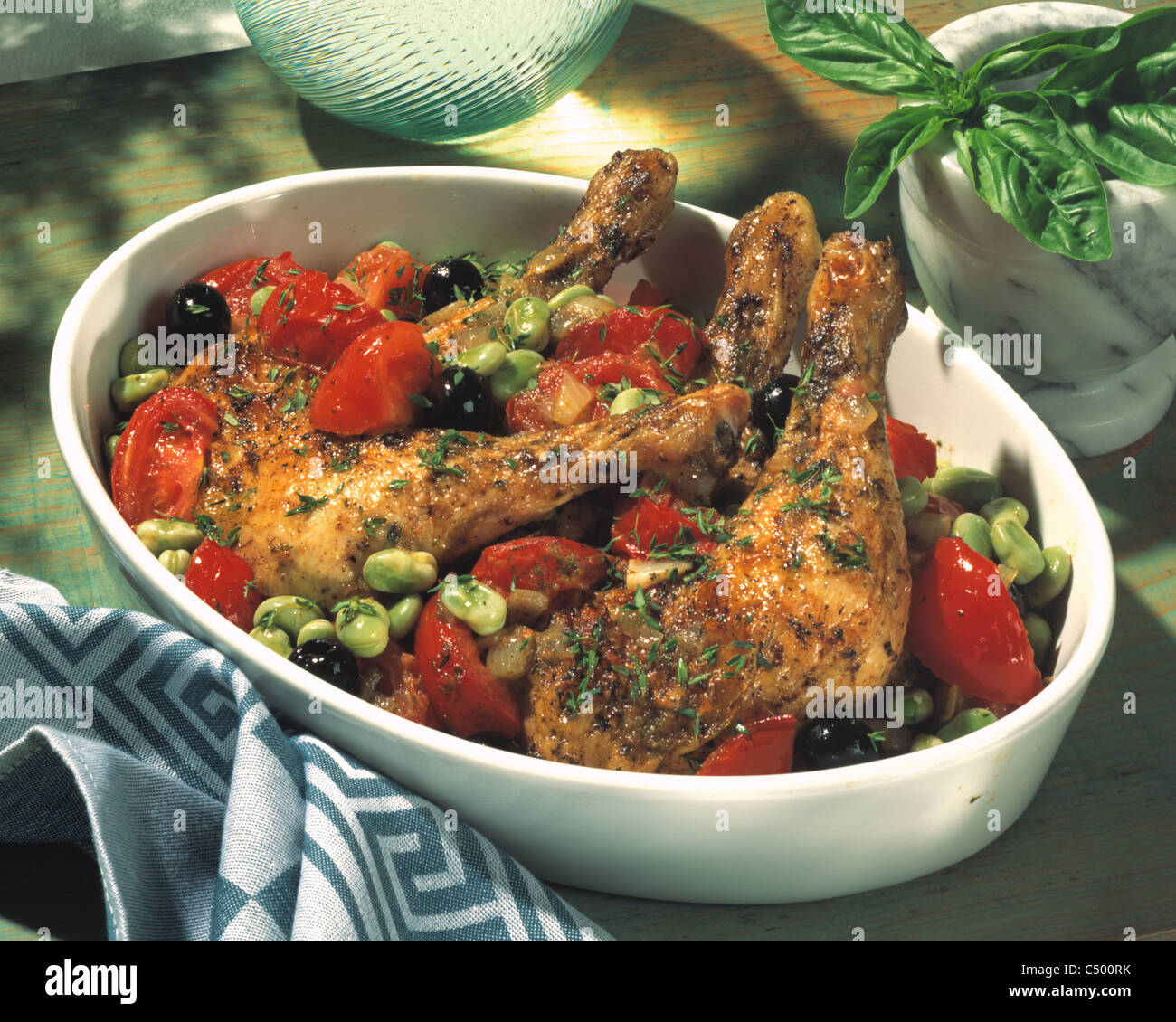 Haunch of chicken with tomato Stock Photo - Alamy