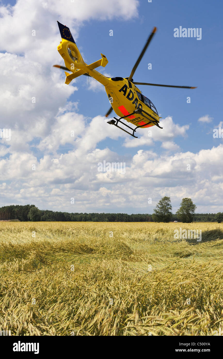 German ADAC Rescue Helicopter in a corn Field Stock Photo - Alamy