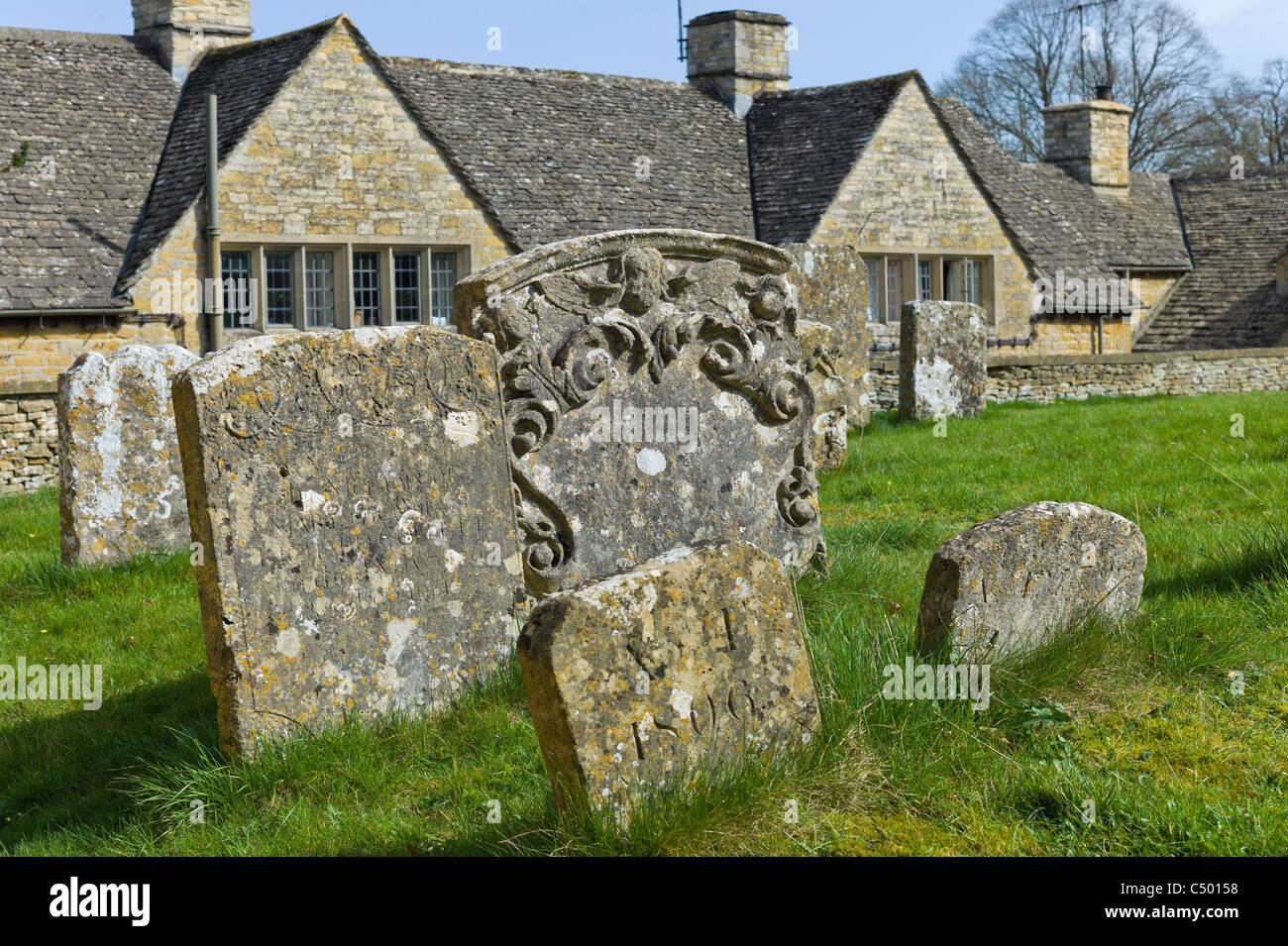 gravestones lit by the sun in a country cemetery Stock Photo - Alamy
