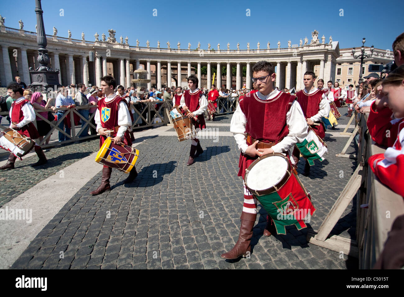Dressed procession members making their way up to St Peter's Basilica ...