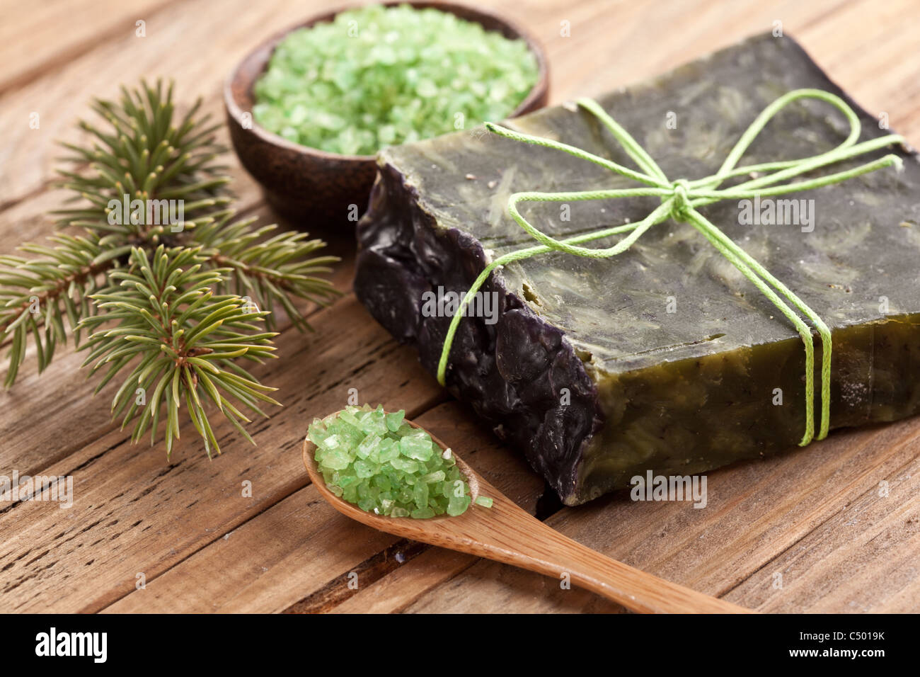 Pine soap with sea-salt and branch of pine Stock Photo - Alamy