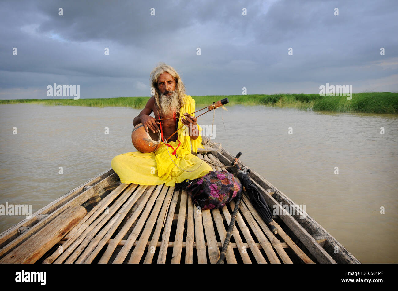 A Baul (Bengali mystic) on the Padma River in Bangladesh Stock Photo ...