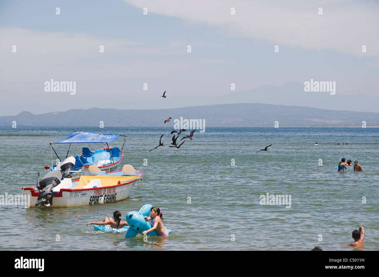 Children playing with boats hi-res stock photography and images - Alamy