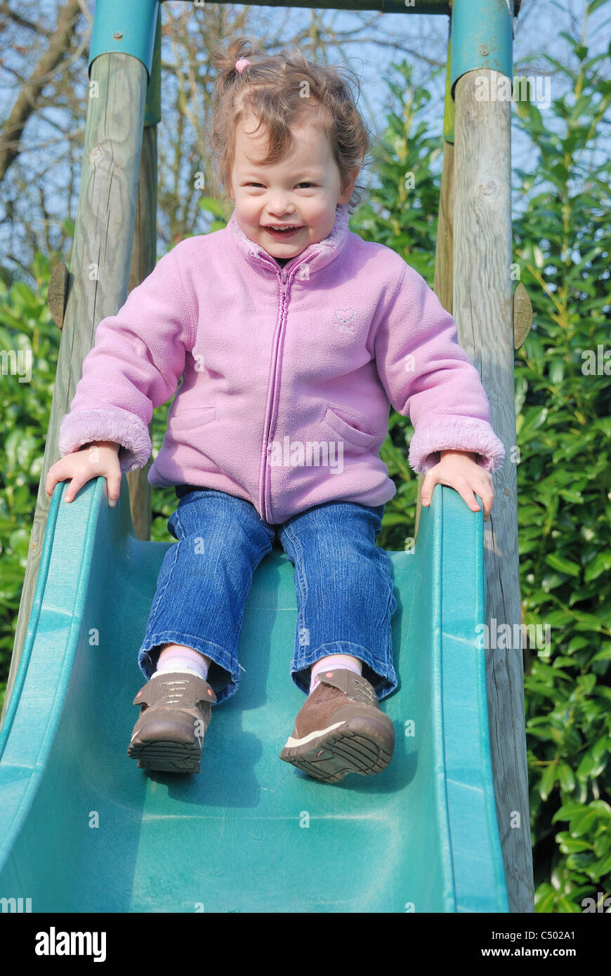 Girl on slide Stock Photo - Alamy