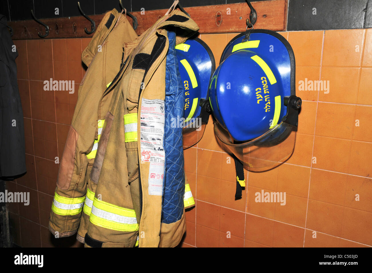 Fire fighters equipment Coats and Helmets Stock Photo - Alamy