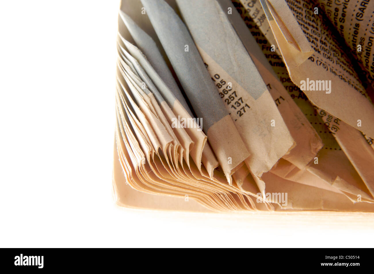 Detailed view of a stack of old papers displaying worn edges and faded ...