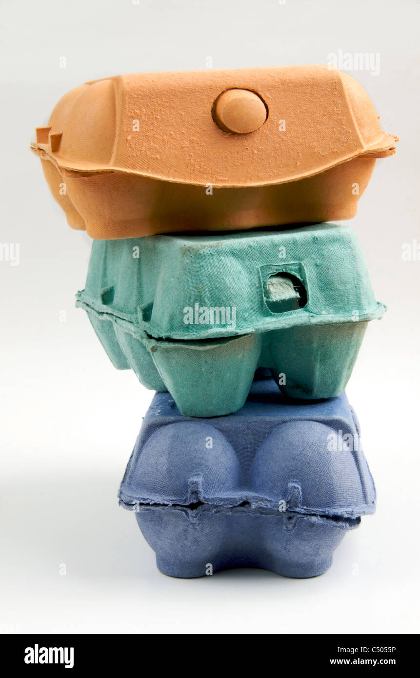 Stacked colorful egg cartons showcasing various colors and designs on a ...