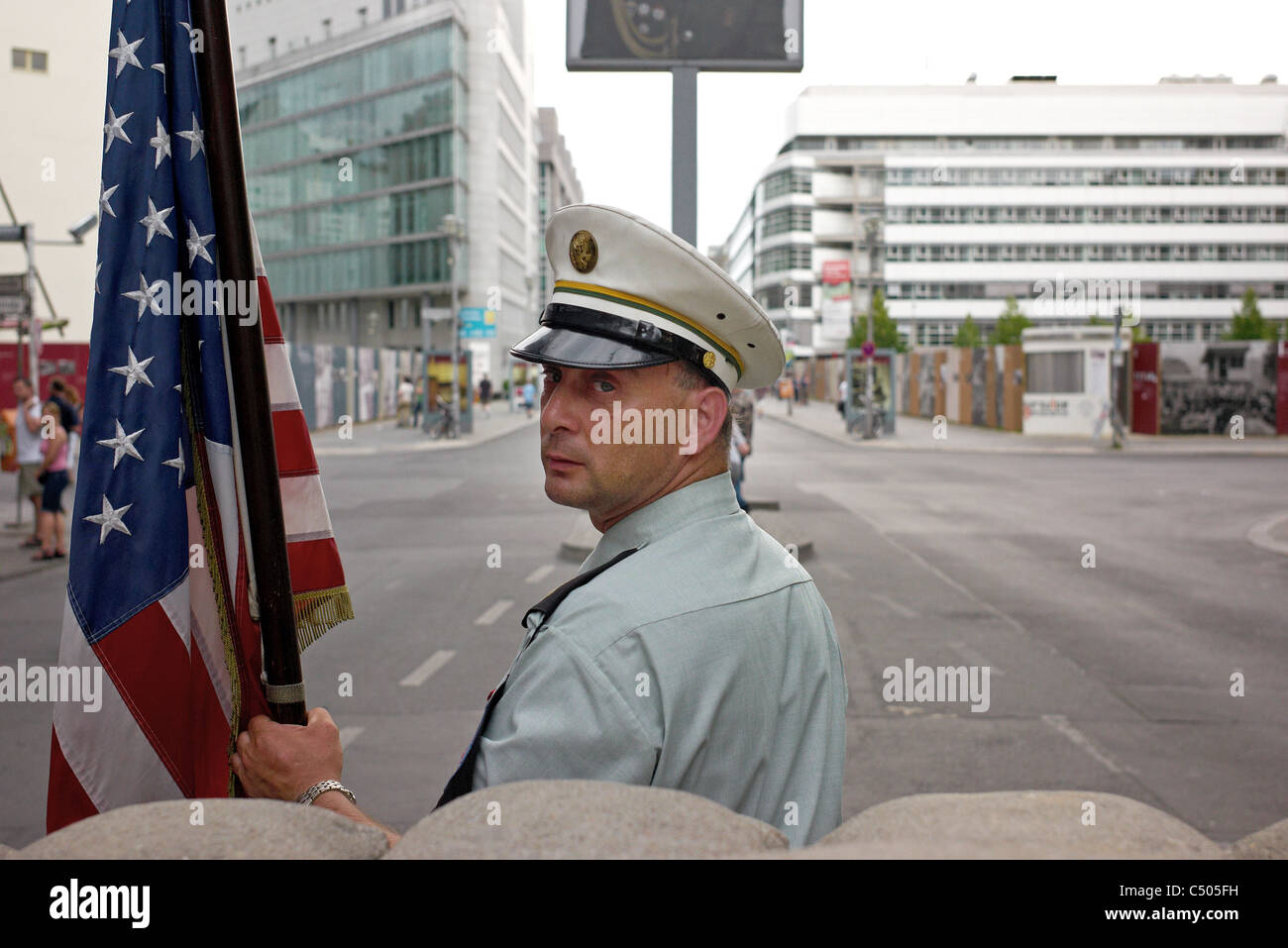 A man dressed as an American soldier at Checkpoint Charlie, Berlin ...