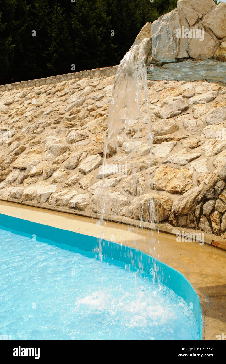 Swimming pool waterfall Stock Photo - Alamy