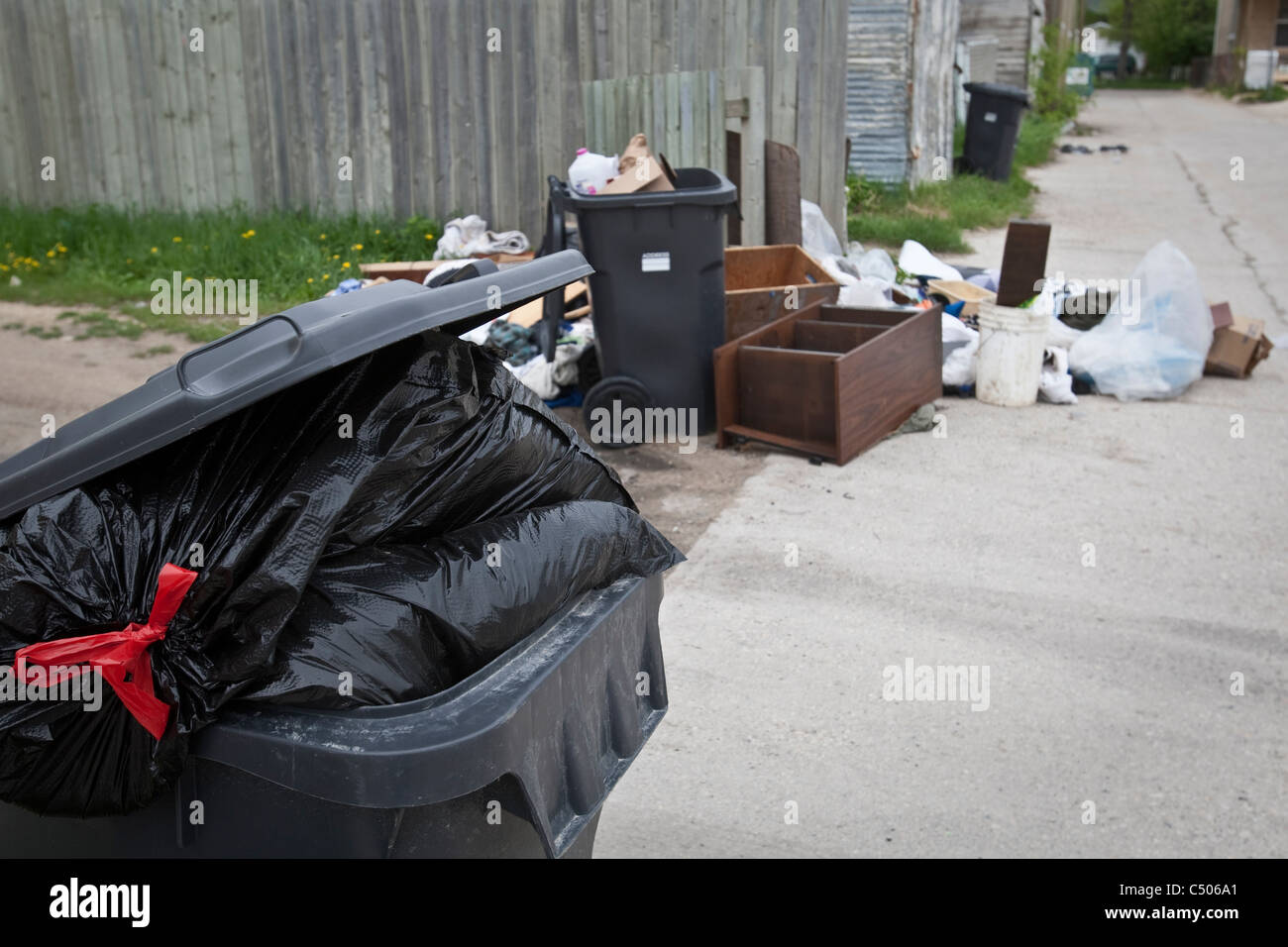 A back alley full of garbage and litters is pictured in Winnipeg Monday ...