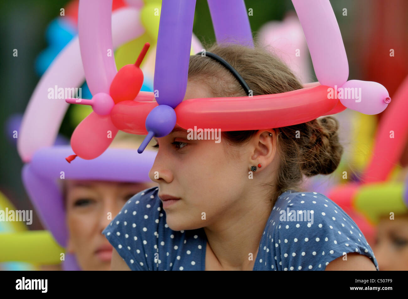 Young girl at the fun fair Stock Photo - Alamy