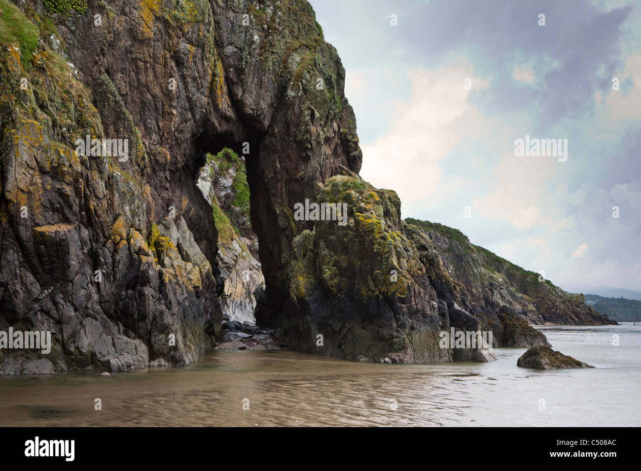 A view of a natural rock arch at the beach on the Solway Firth Scotland ...