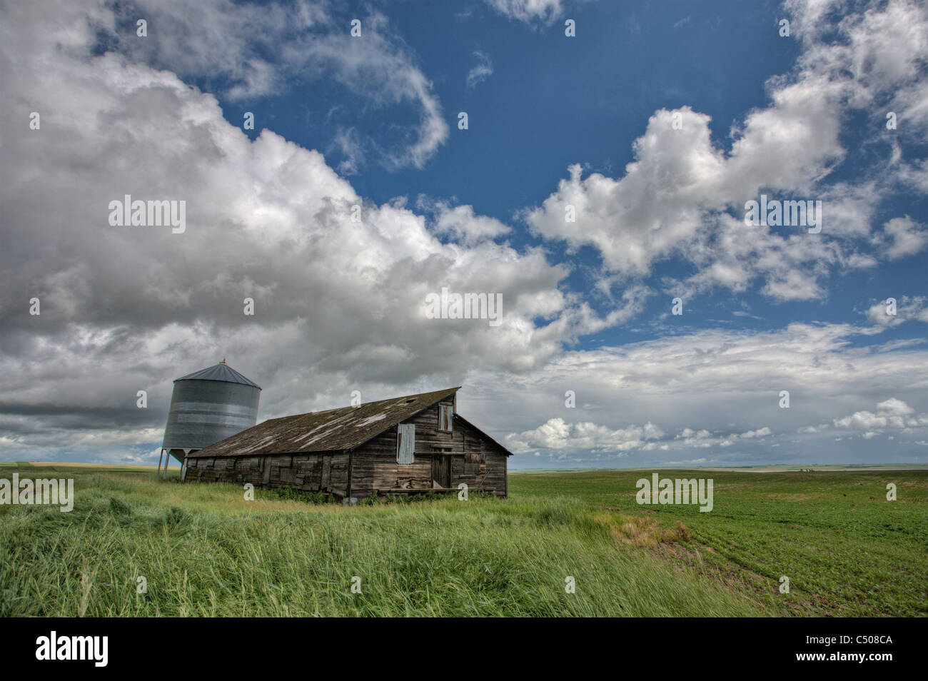 Abandoned Farm with storm clouds in the Canadian Prairie Stock Photo ...