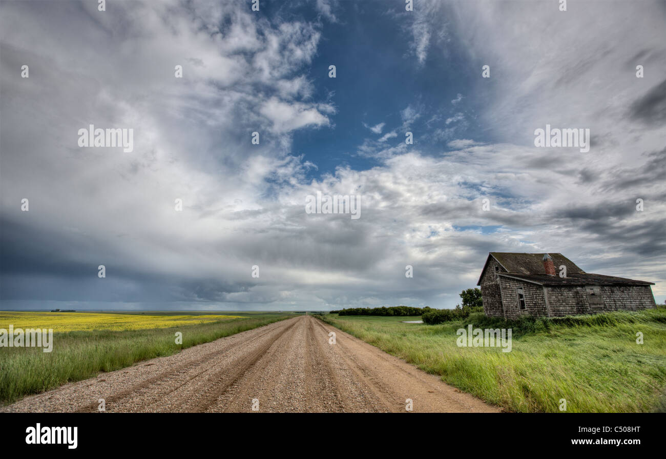 Abandoned Farm with storm clouds in the Canadian Prairie Stock Photo ...