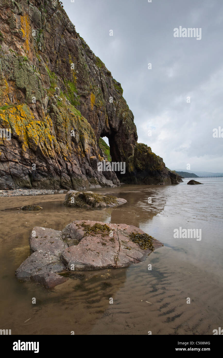 A view of a natural rock arch at the beach on the Solway Firth Scotland ...