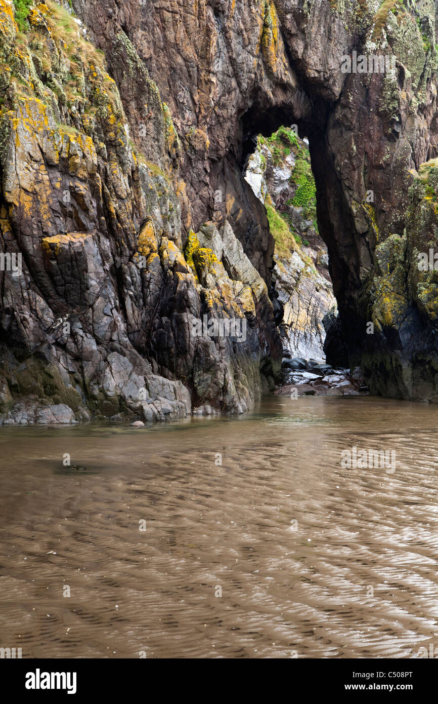 A view of a natural rock arch at the beach on the Solway Firth Scotland ...