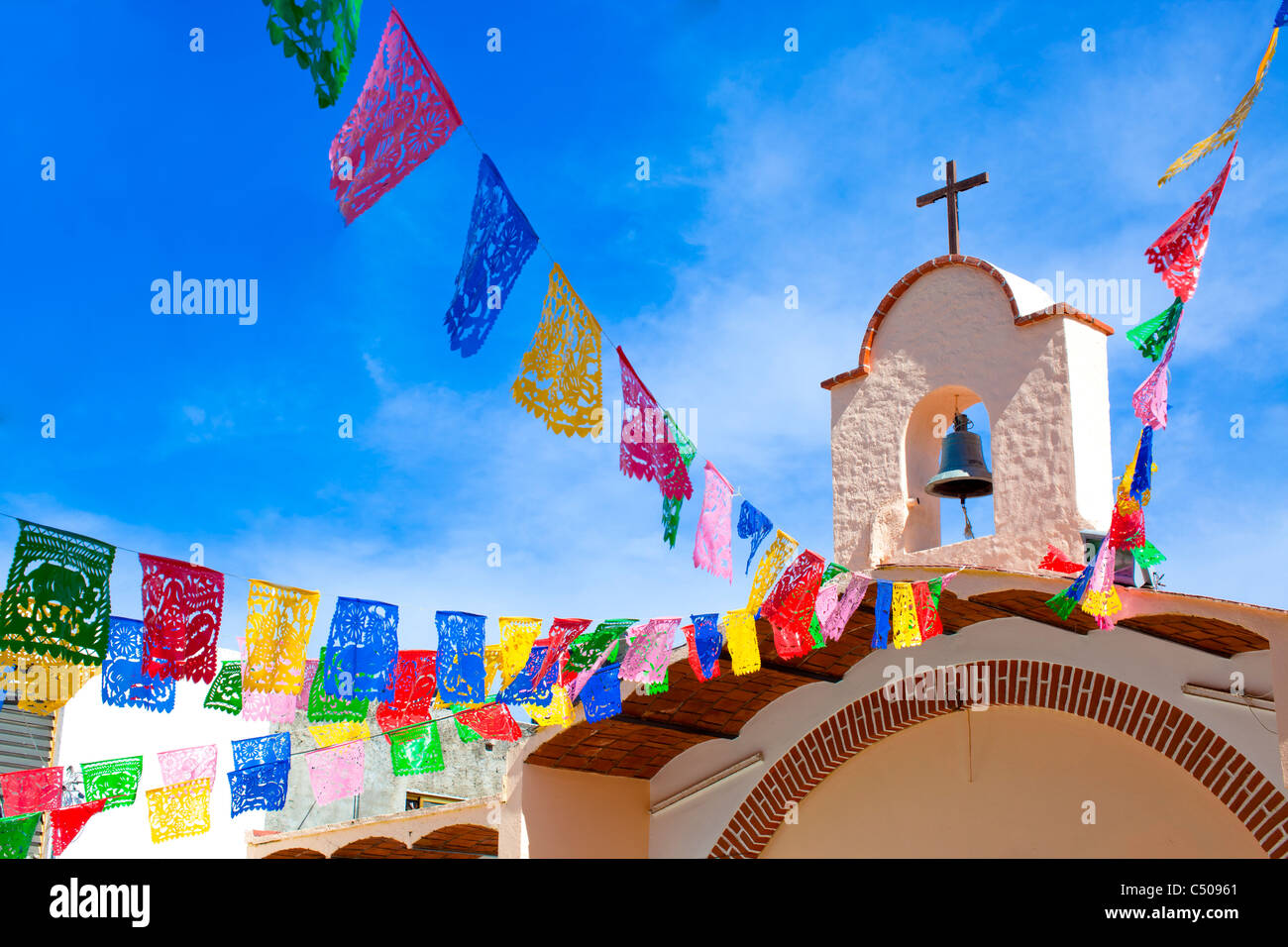 Colorful flags decorating church Stock Photo - Alamy