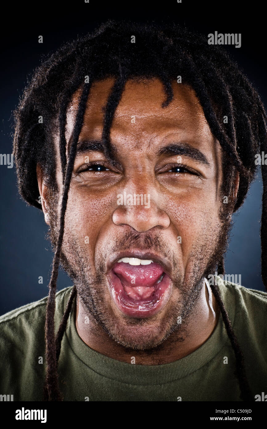 Grimacing Black man Stock Photo - Alamy
