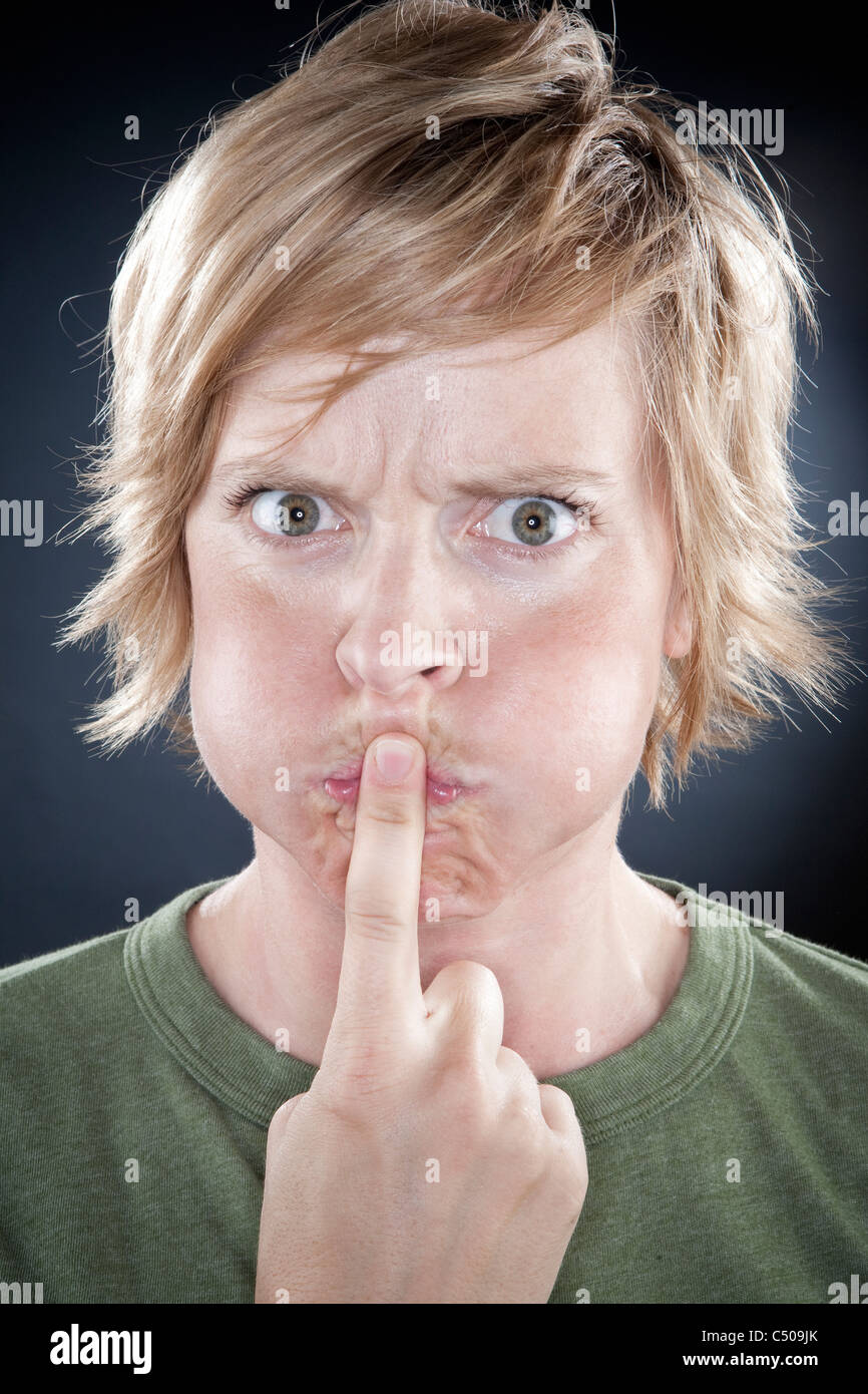 Face One Finger Over Mouth High Resolution Stock Photography and Images ...