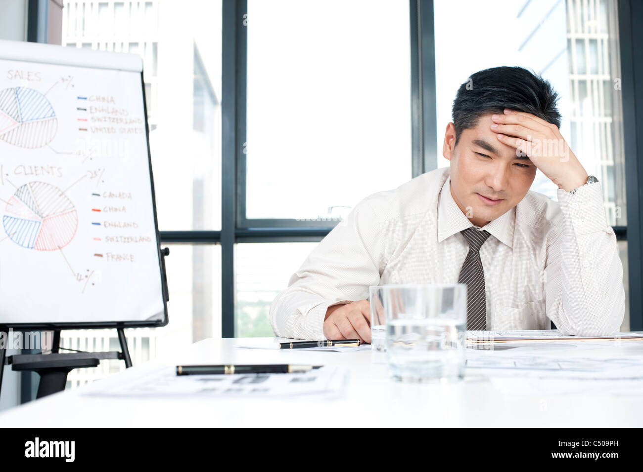 Business Executive Focusing on Document Stock Photo - Alamy