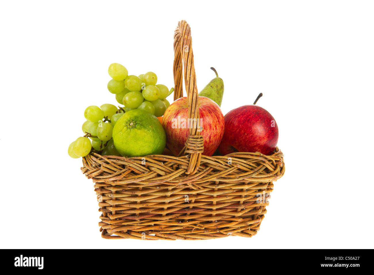 wicker basket full with fresh fruit isolated over white background ...