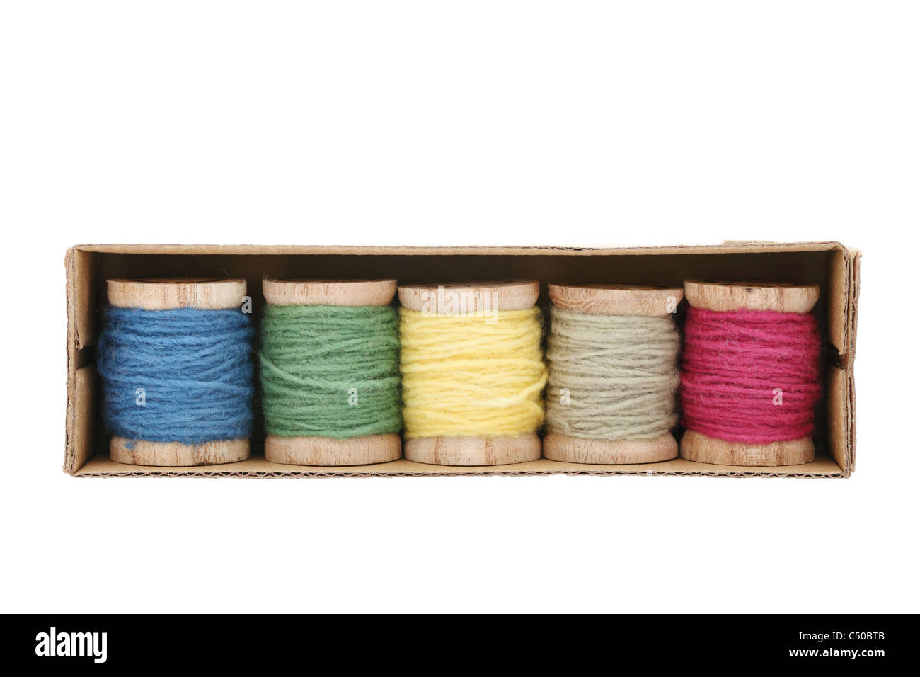 Spool of thread isolated on white background Stock Photo - Alamy