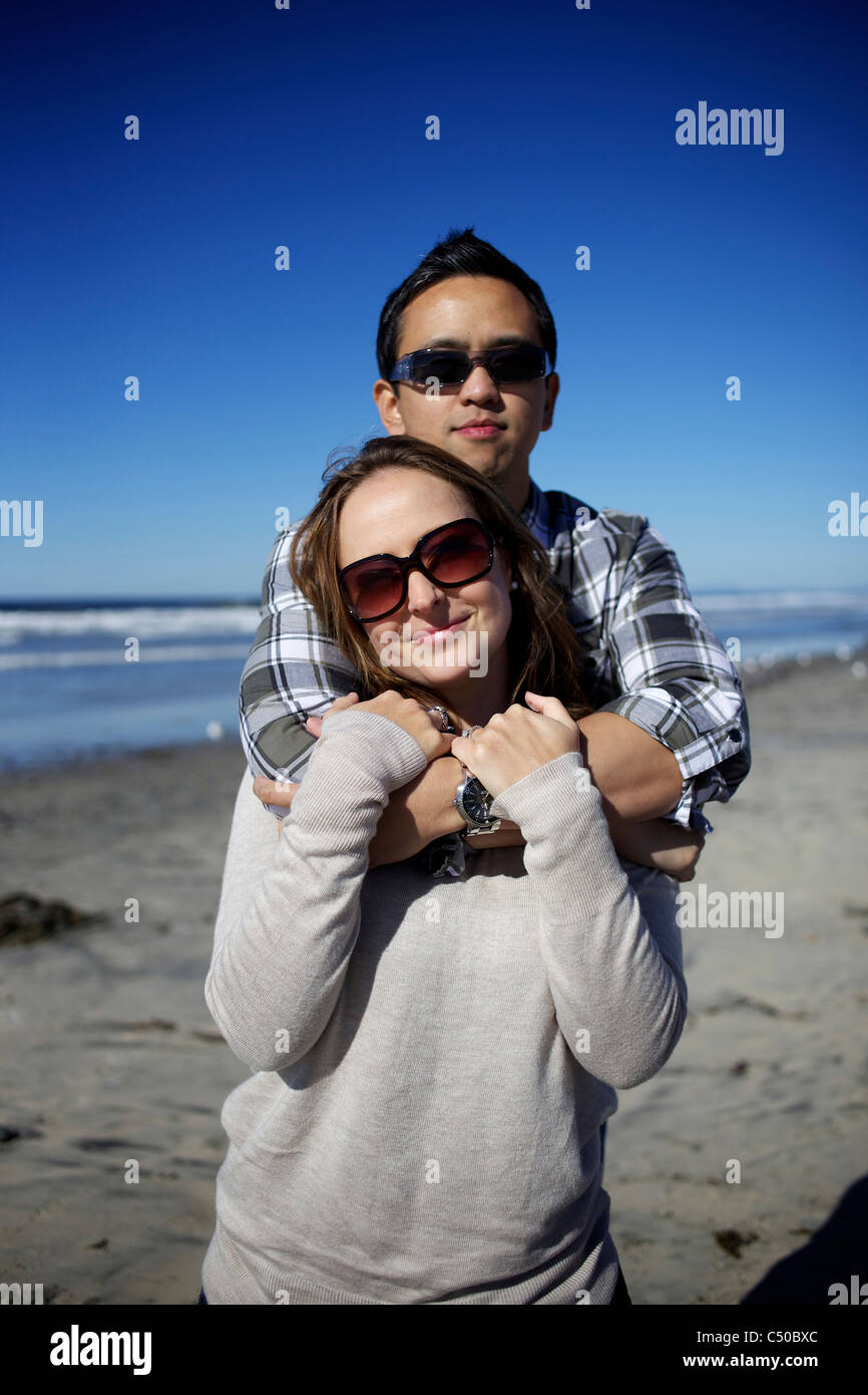 Couple hugging on beach Stock Photo - Alamy