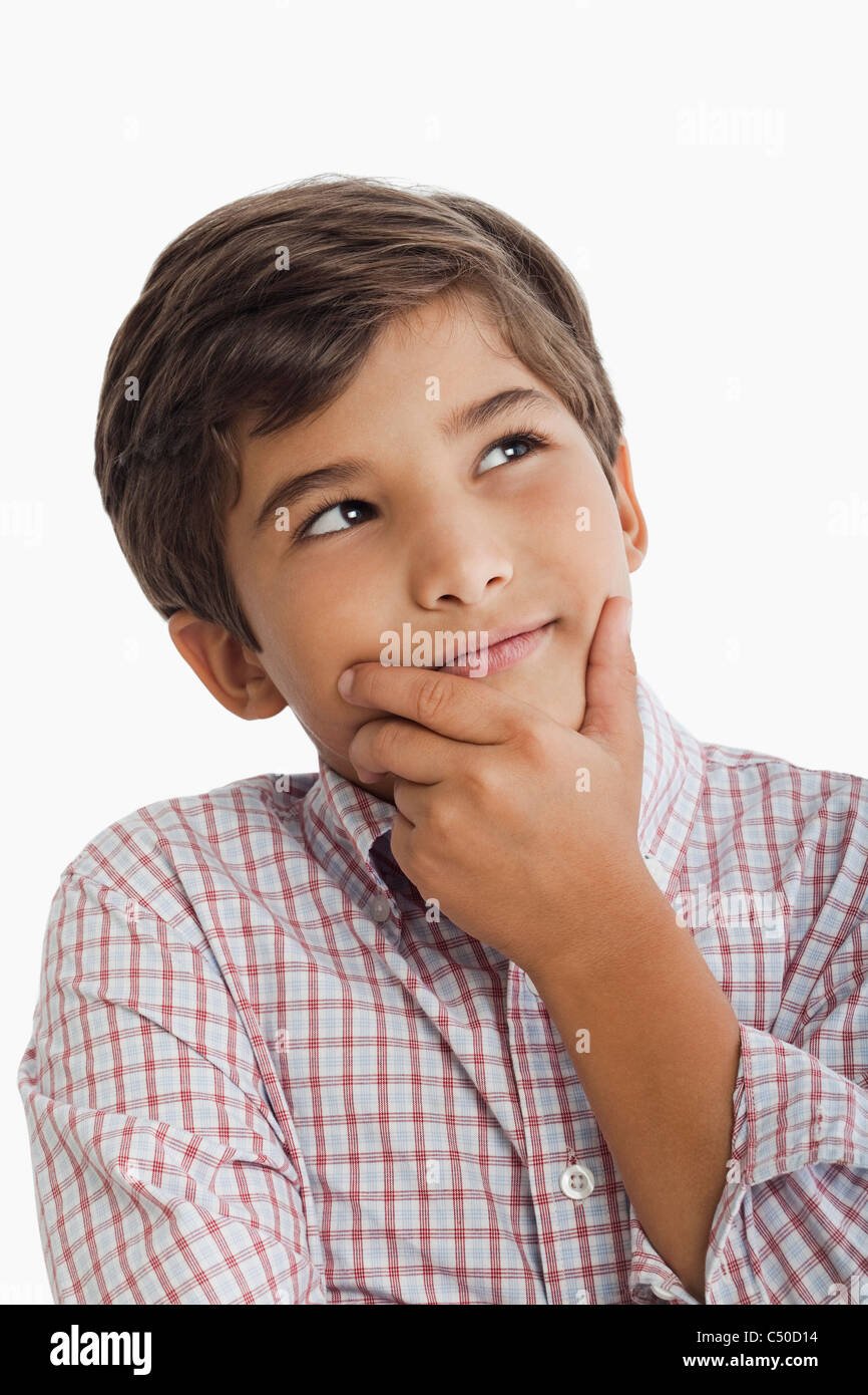 Hispanic boy thinking Stock Photo - Alamy