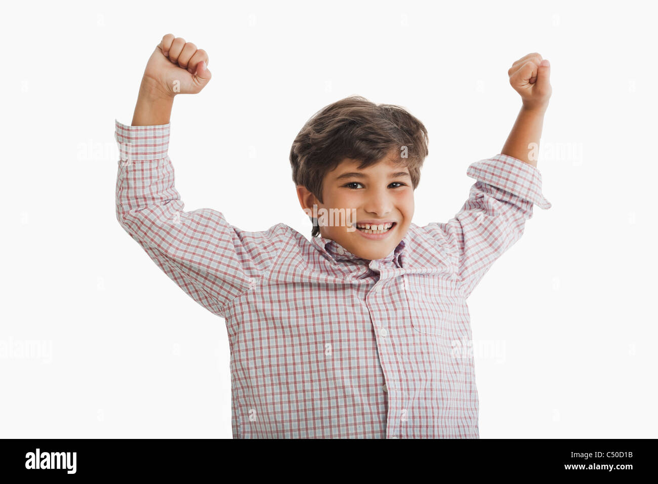 Cheering Hispanic boy Stock Photo - Alamy