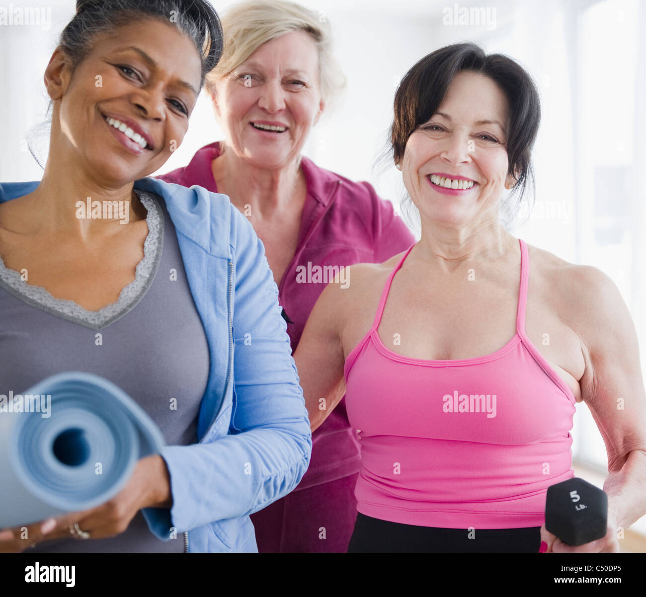 Friends in exercise class Stock Photo - Alamy